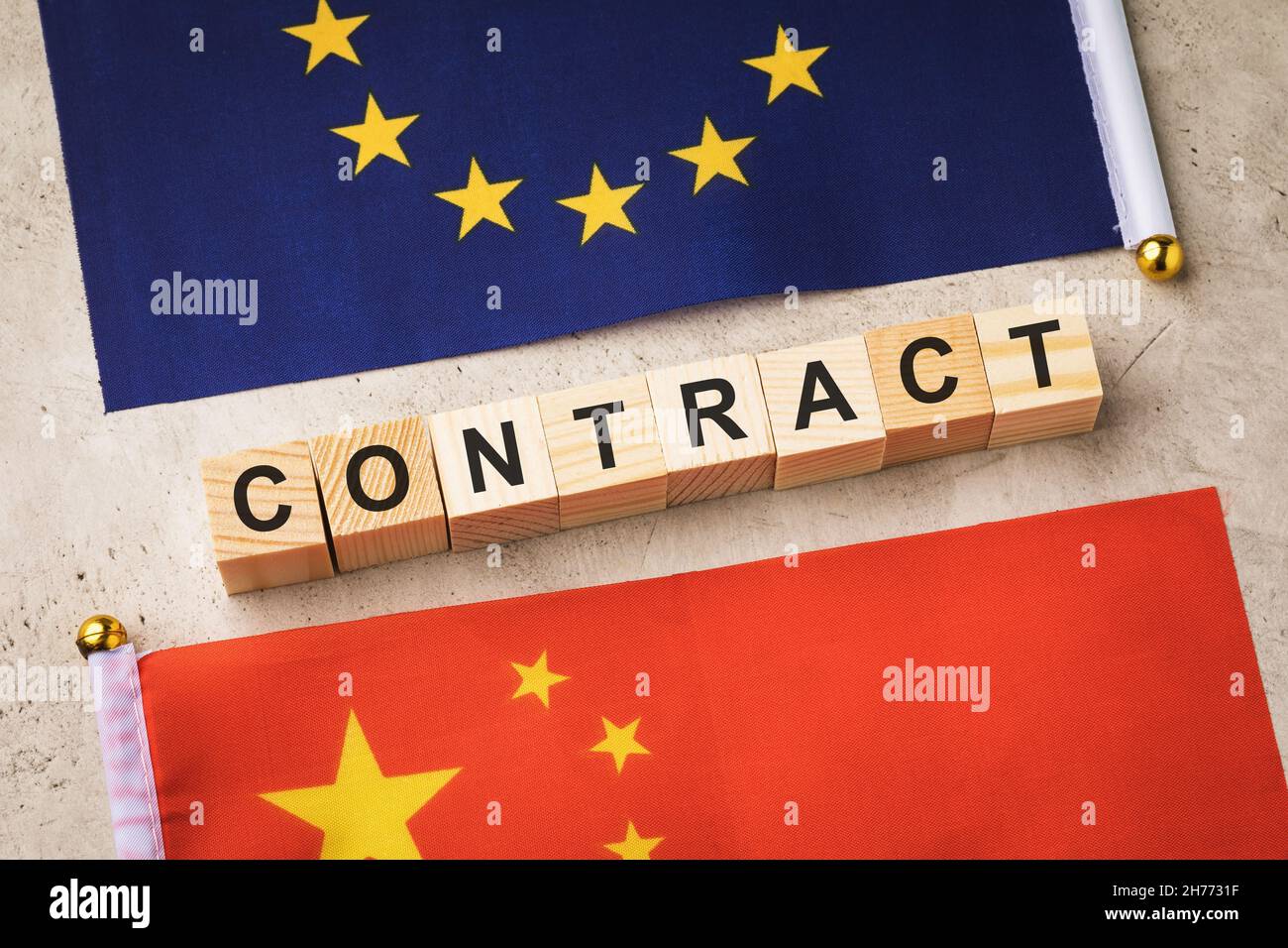 Wooden cubes with text surrounded by flags of Europe and America ...