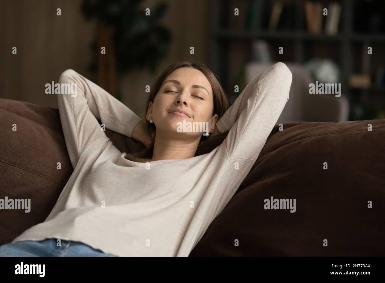 Dreamy woman fall asleep on sofa at home Stock Photo - Alamy