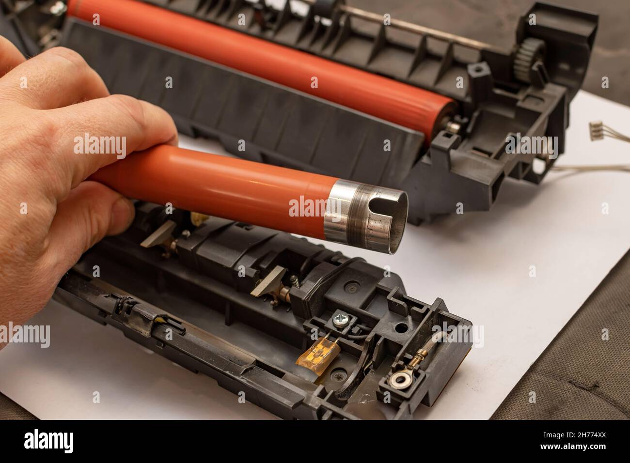 view of a worn out upper heating shaft, roller from a printer in the ...