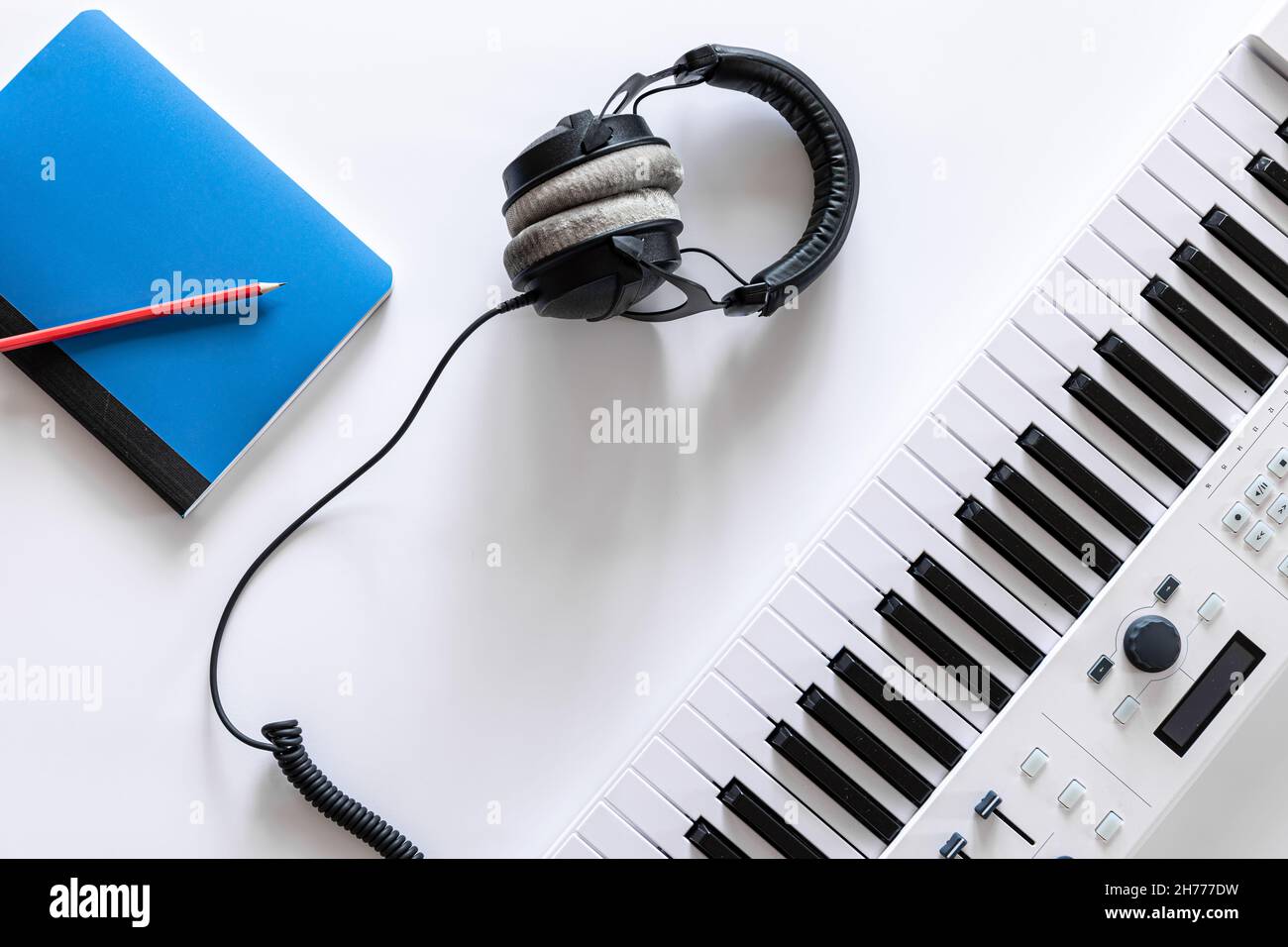 Musical flat lay background with headphones musical keys Stock Photo ...