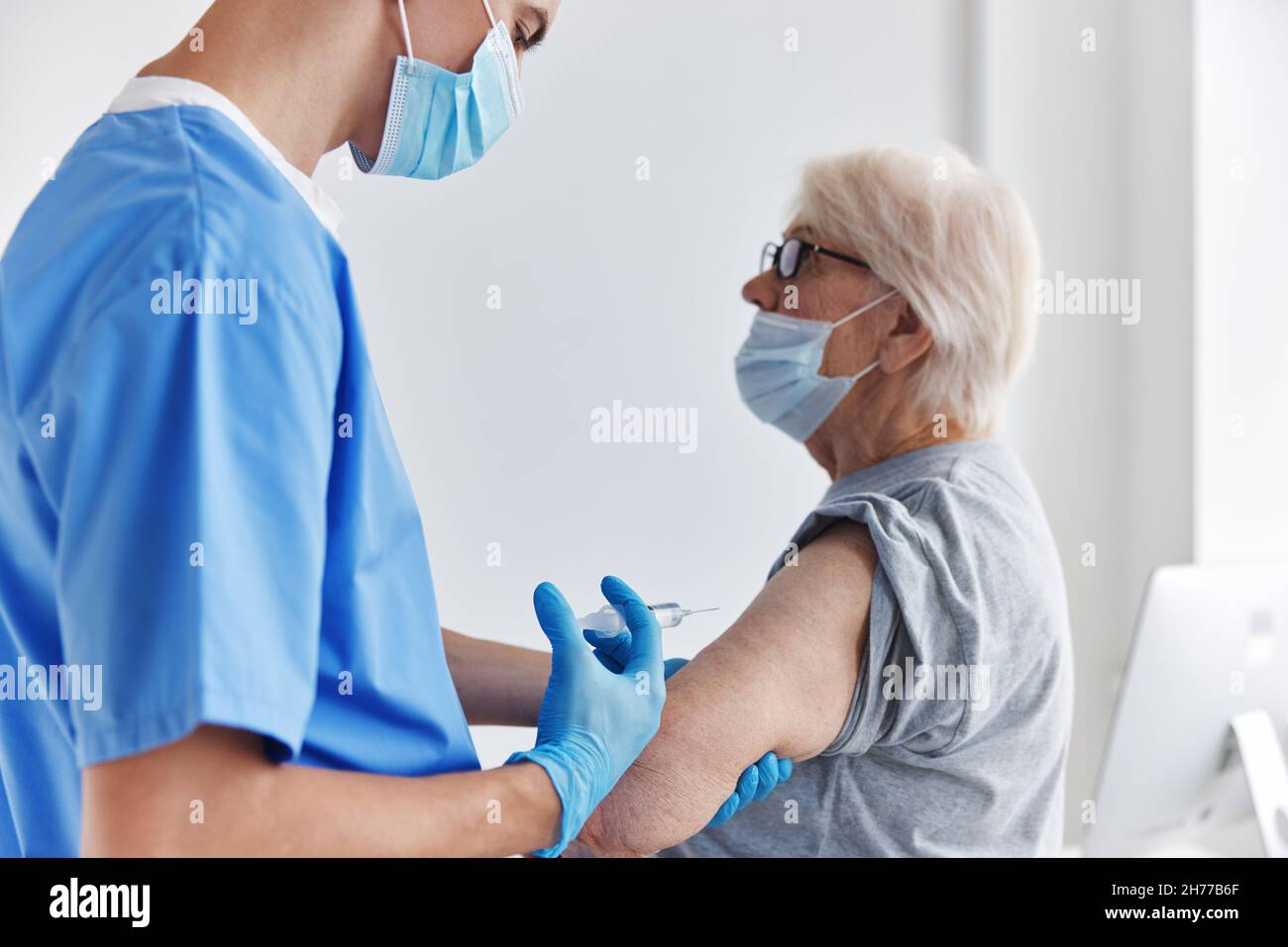 male doctor arm injection vaccine passport health care Stock Photo - Alamy