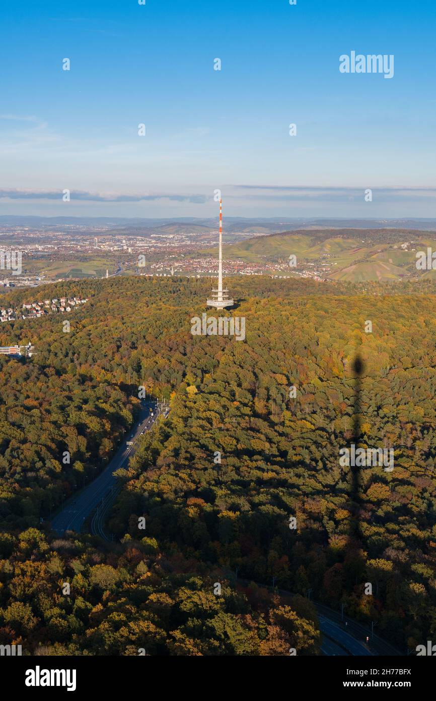 An aerial view of telecommunication tower surrounded by forest trees ...
