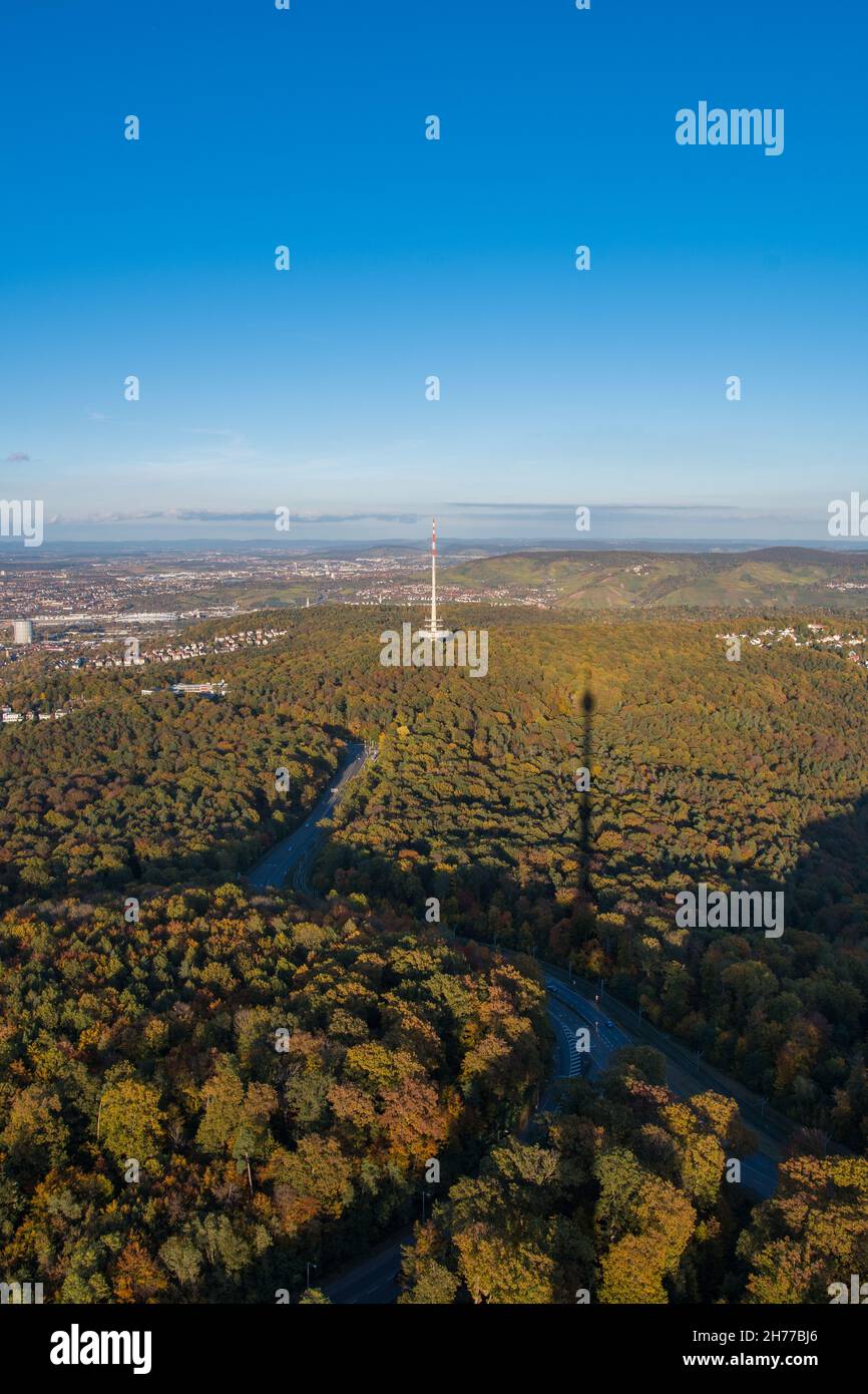 An aerial view of telecommunication tower surrounded by forest trees ...