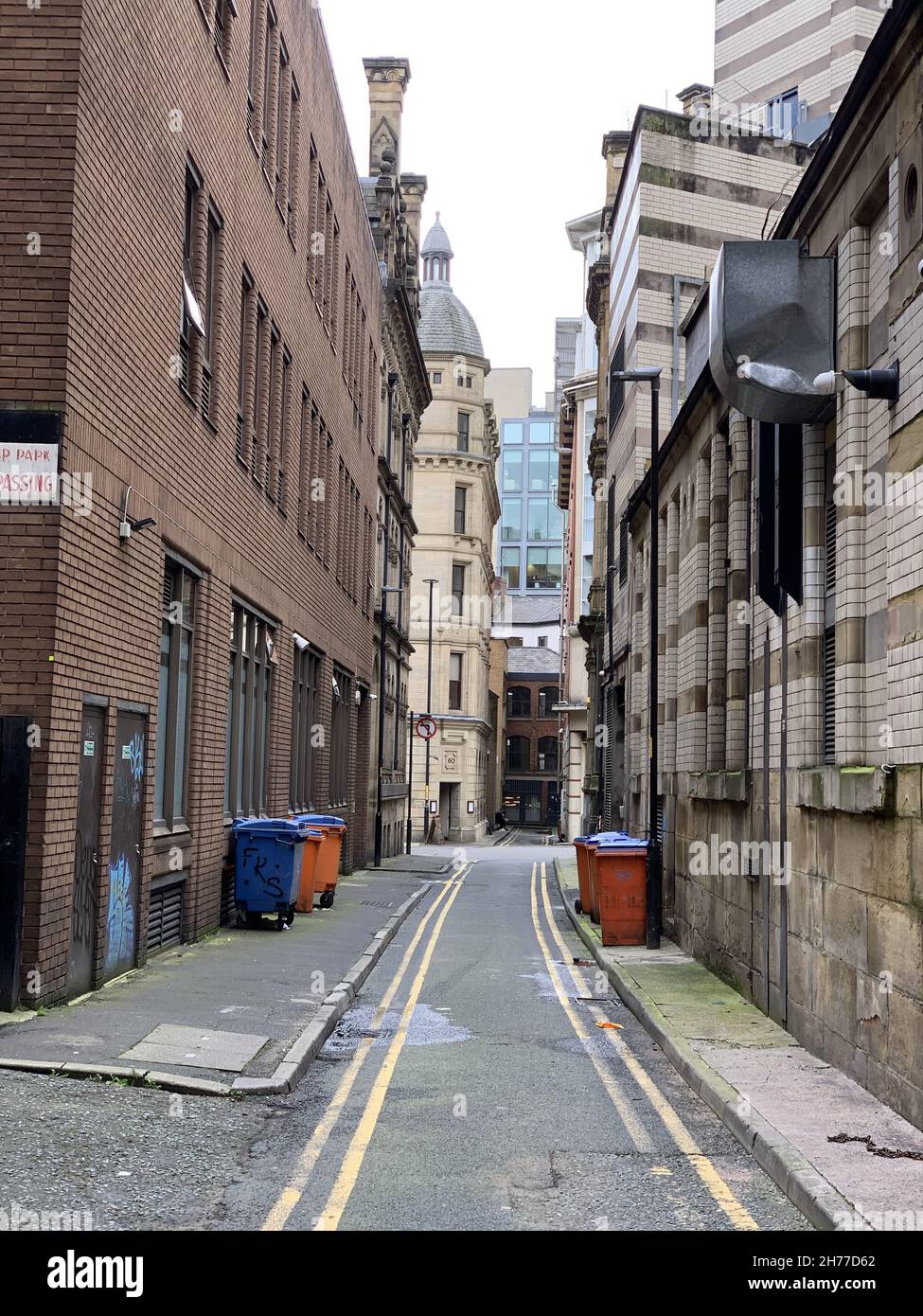 MANCHESTER, UNITED KINGDOM - Aug 25, 2021: An empty narrow street with ...