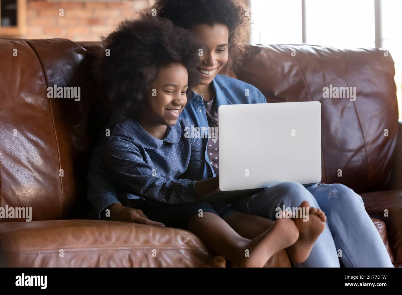Happy African American family using computer apps Stock Photo - Alamy