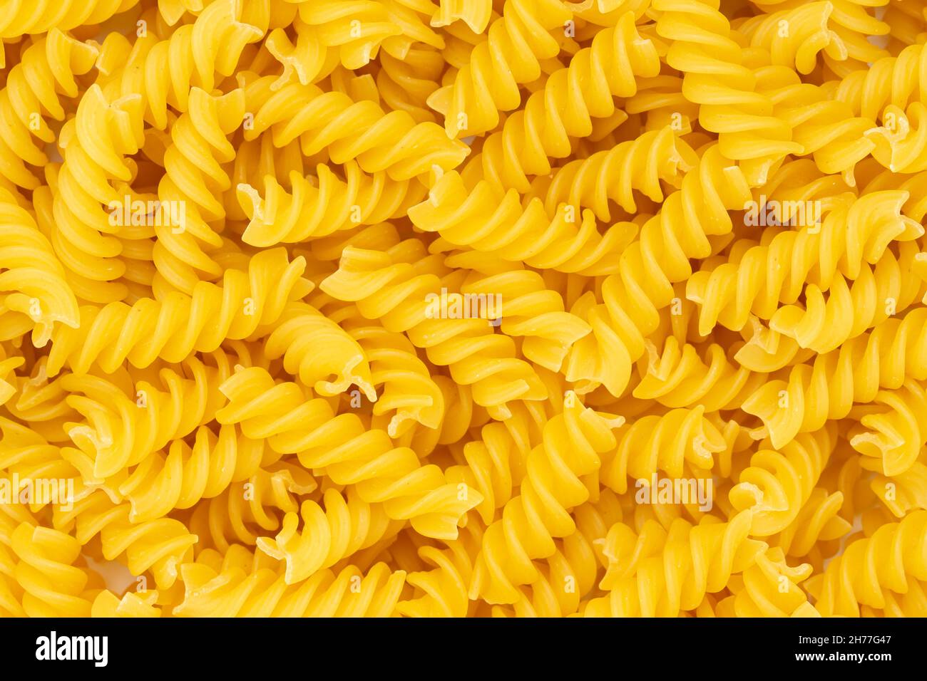 Close-up of raw pasta, texture or background Fusilli. Raw and Dry ...