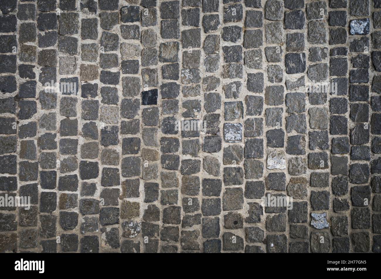 Overhead shot of a cobblestone structure on the ground of an urban ...