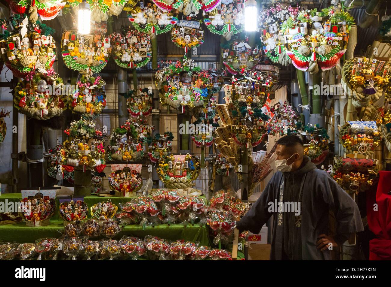Kumade (rake) stall holder seen at the Tori no Ichi or Cock festival at ...
