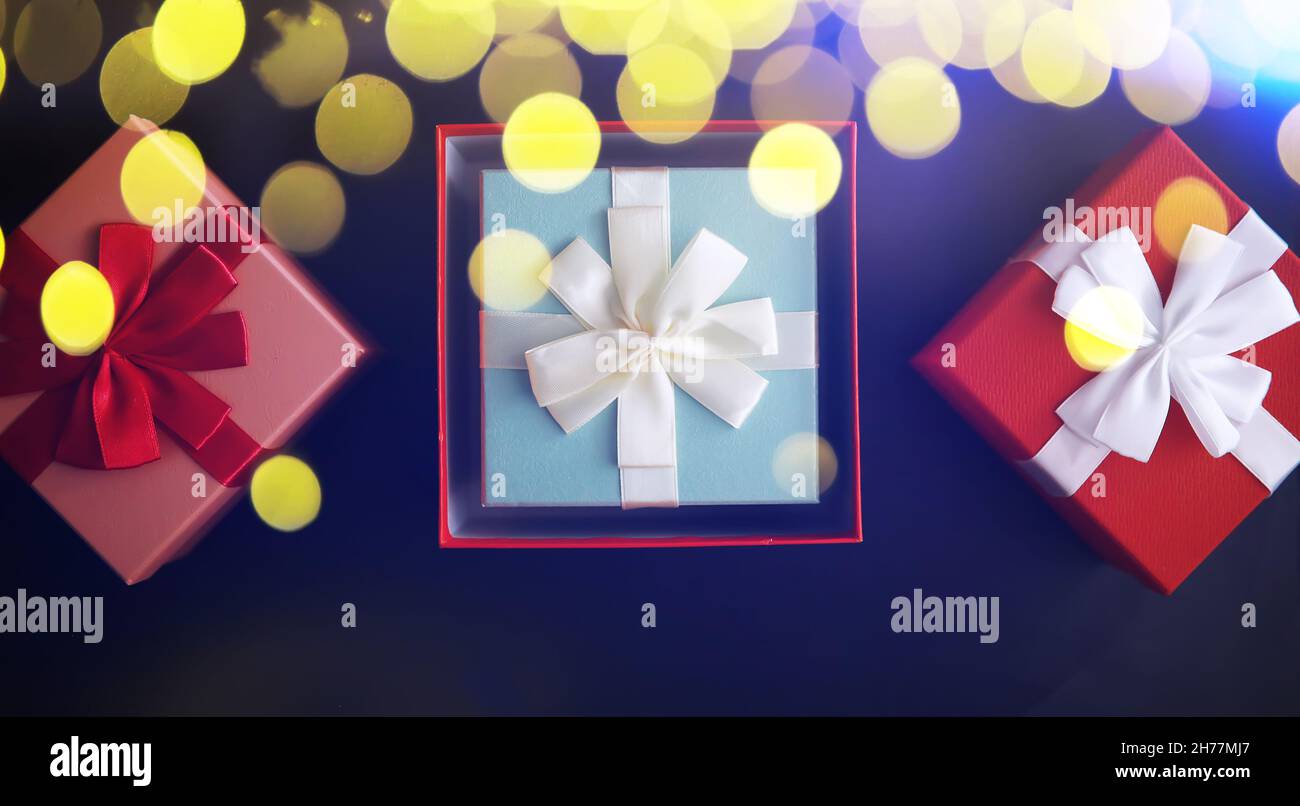 Christmas decoration. Gift boxes on black stone background. Top view ...