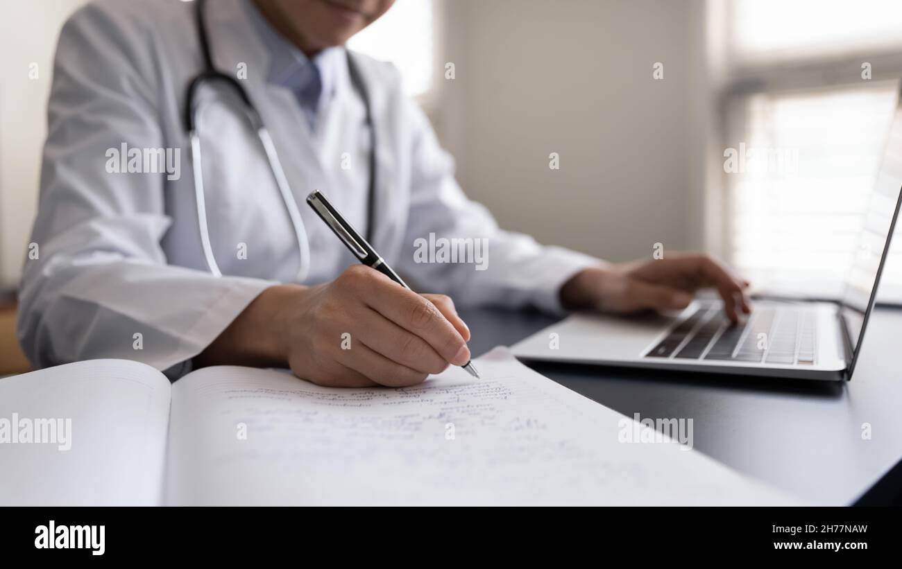 Indian doctor writing hi-res stock photography and images - Alamy