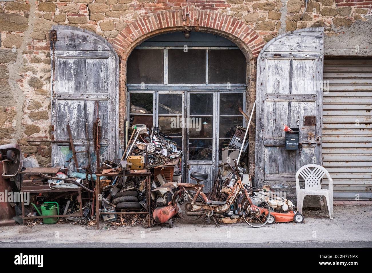 A scenery of waste and old objects on the street Stock Photo - Alamy