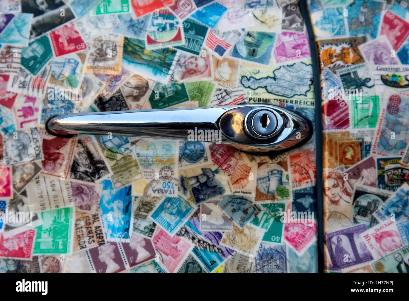 A historic car covered with postage stamps Stock Photo - Alamy