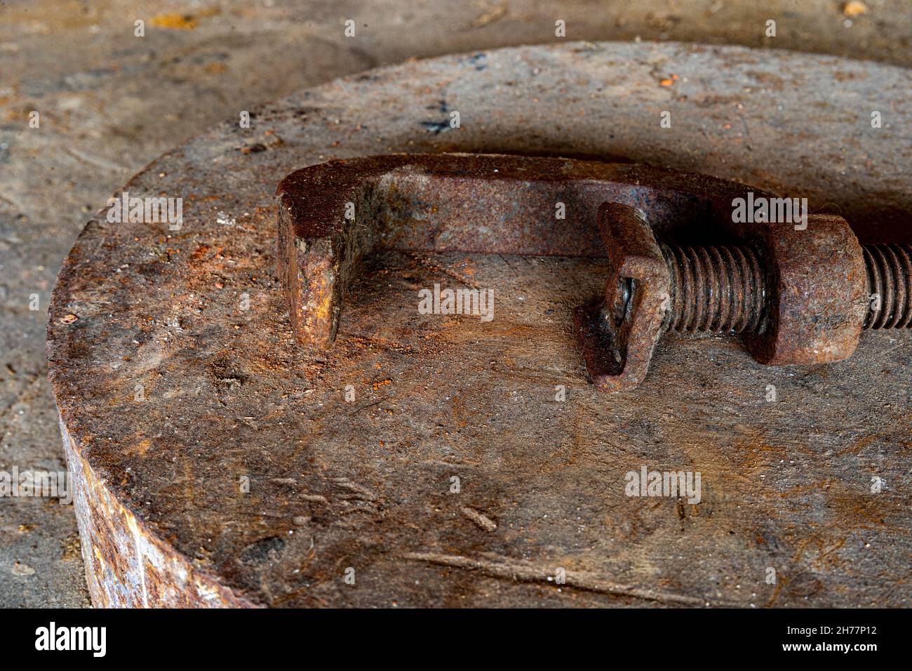 An antique work tool - hitch on a rusty surface Stock Photo - Alamy