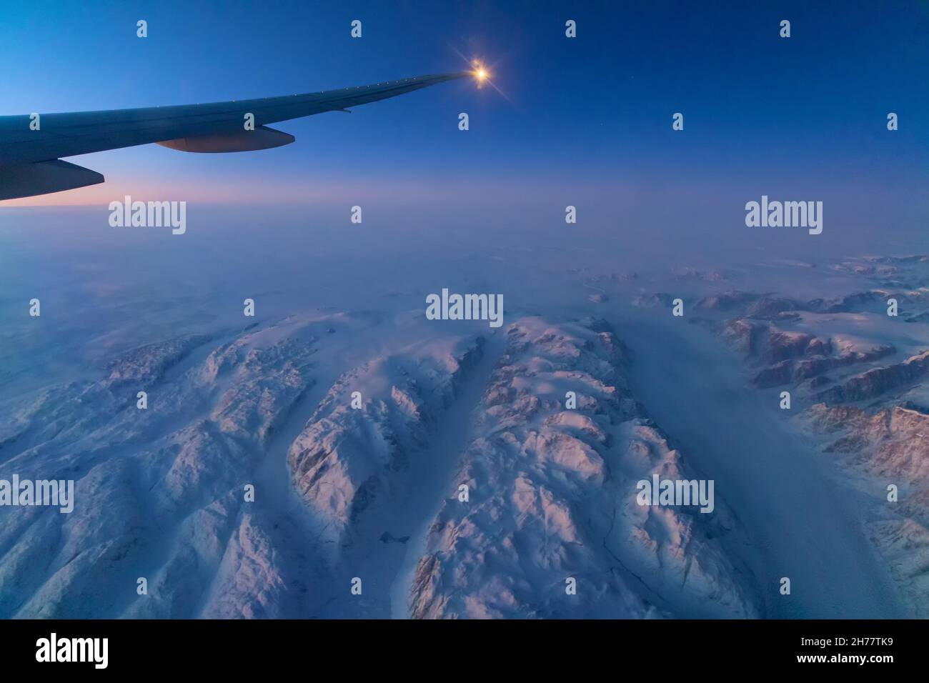 Aerial dramatic top view on snow covered mountains and glaciers in ...