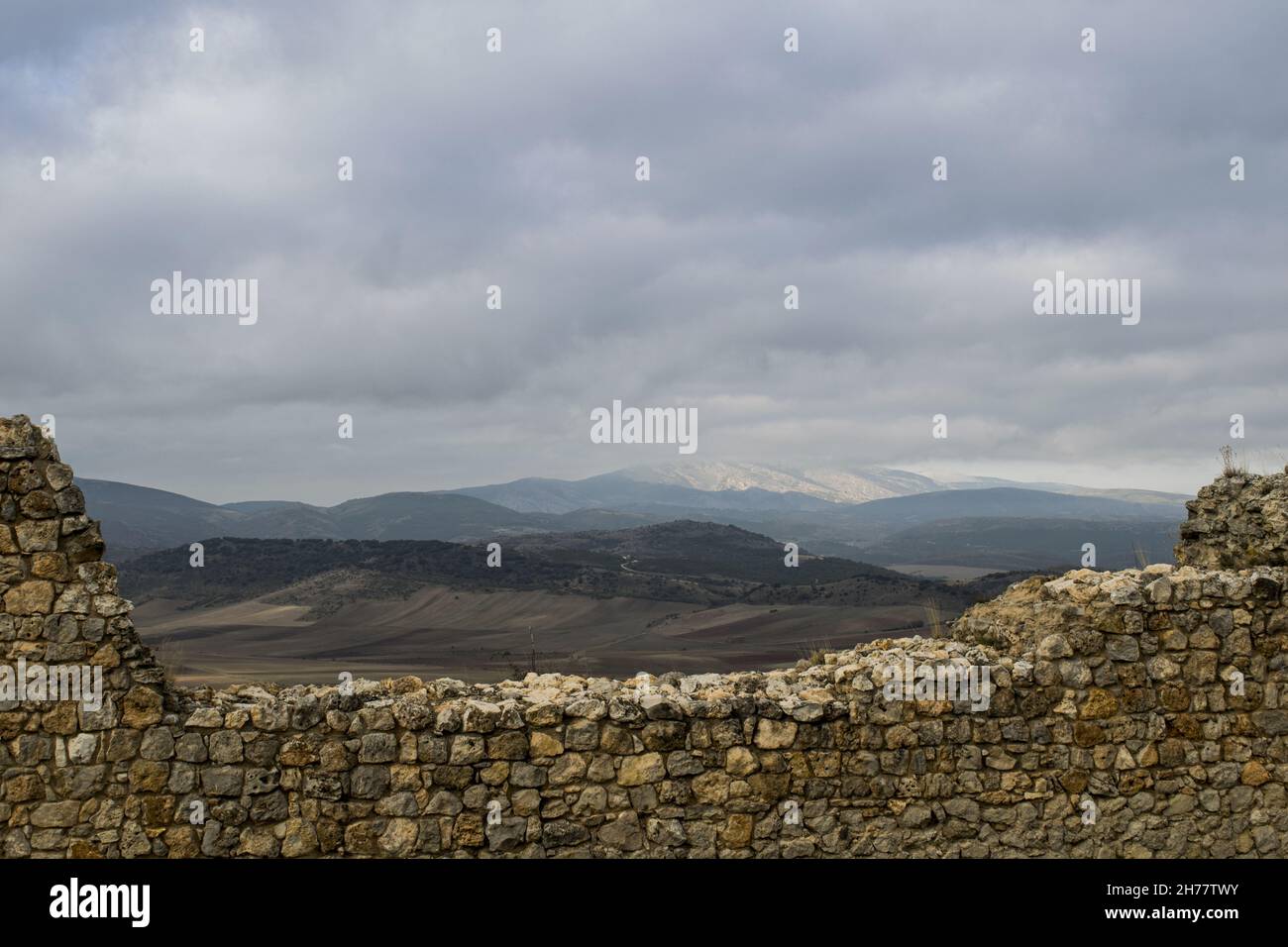 A scenic view of a landscape seen from the ruins of an old city wall ...