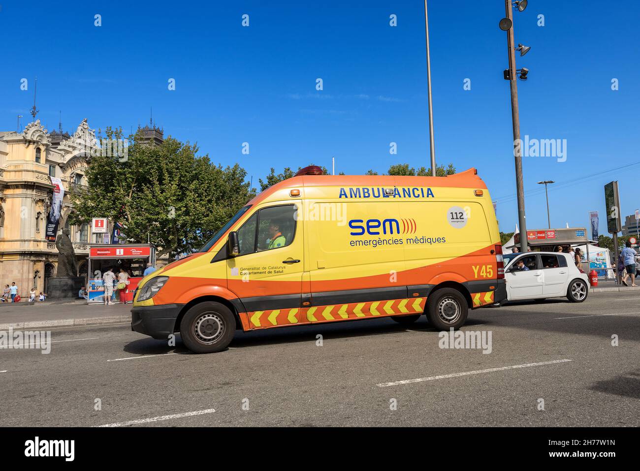 Yellow and Orange Ambulance in a downtown street of Barcelona ...
