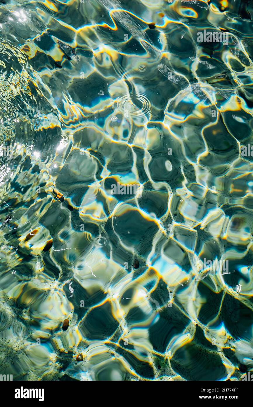 A vertical shot of water waves and shadows on a sunny day - perfect for ...