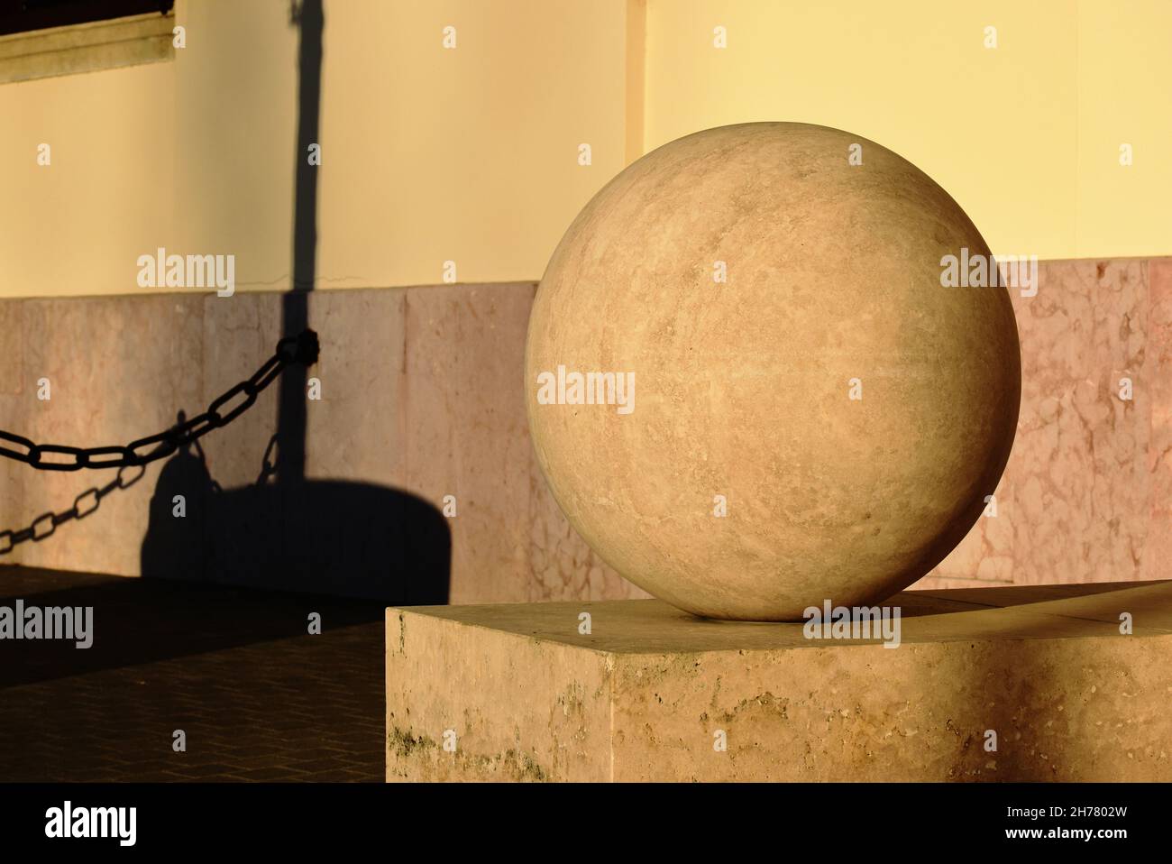decorative smooth stone sphere. cube pedestal along the side of ...