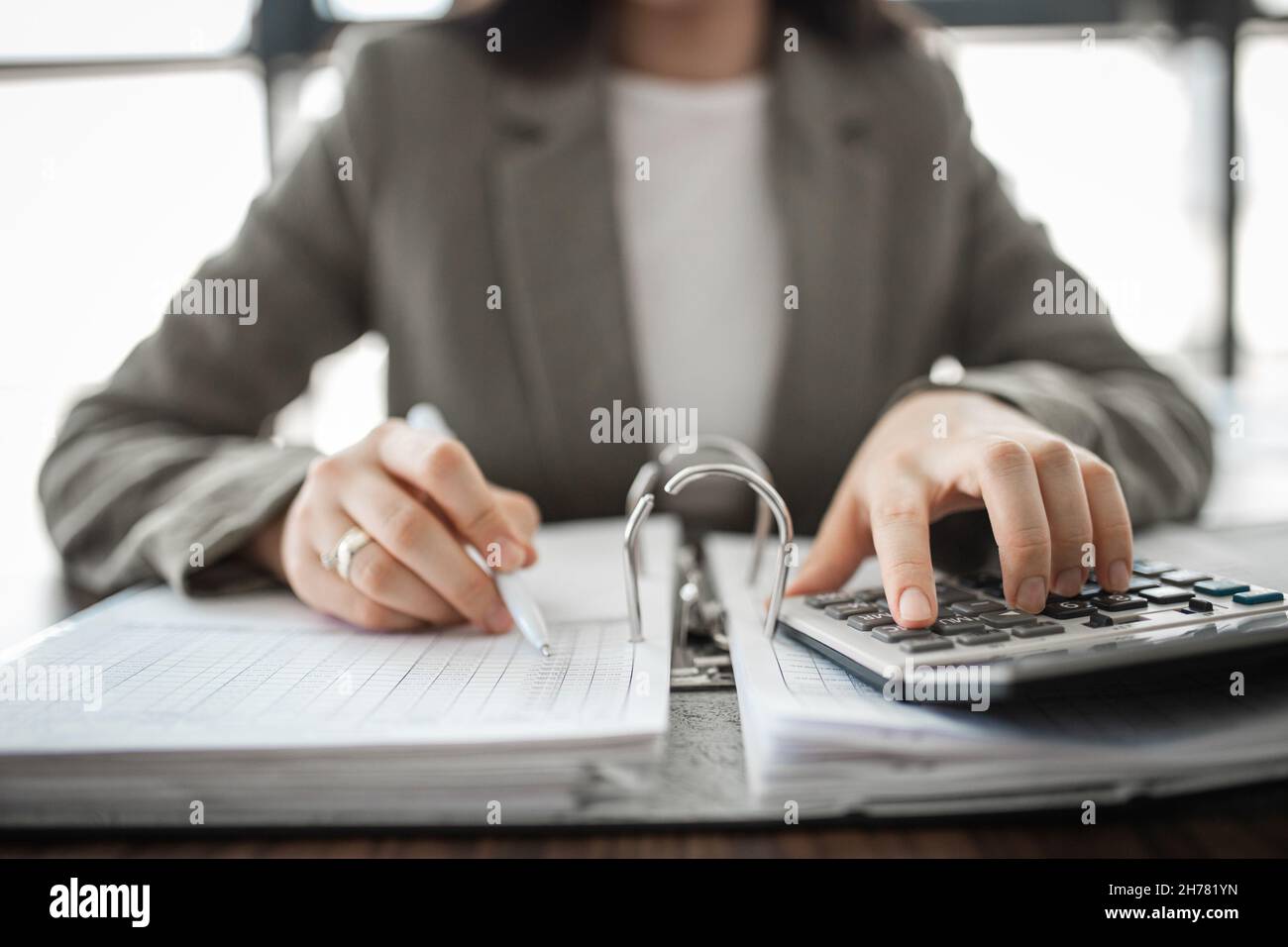 the businessman hands calculating invoice with calculator Stock Photo ...