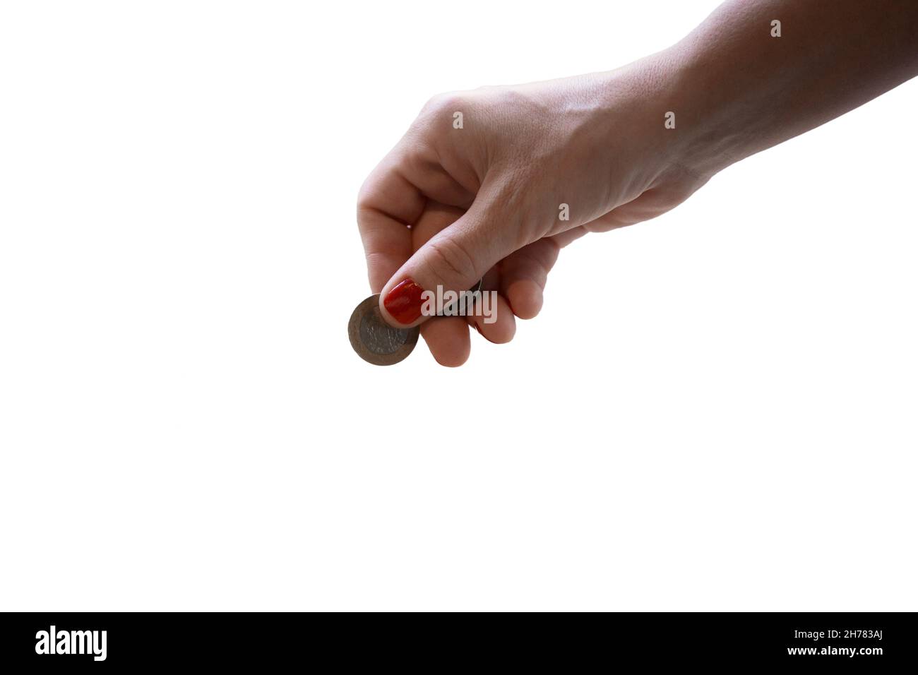 woman hand holding coin in front of isolated background Stock Photo - Alamy