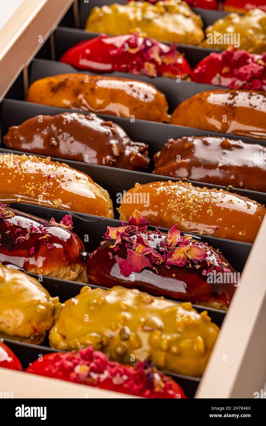 Set of eclairs. Amazing fresh colorful eclairs with icing Stock Photo ...
