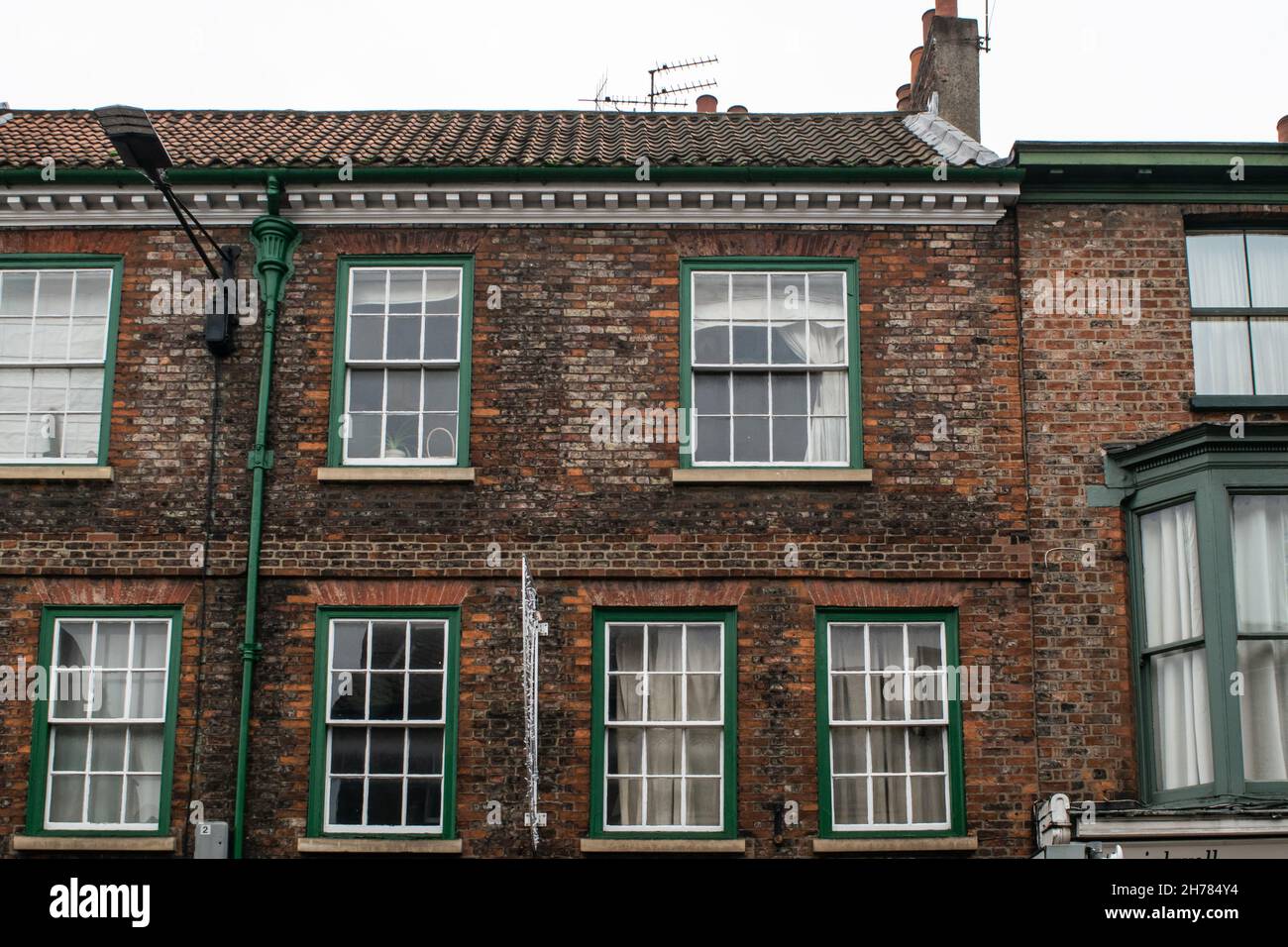 Facade of traditional British old brick townhouses in York England ...