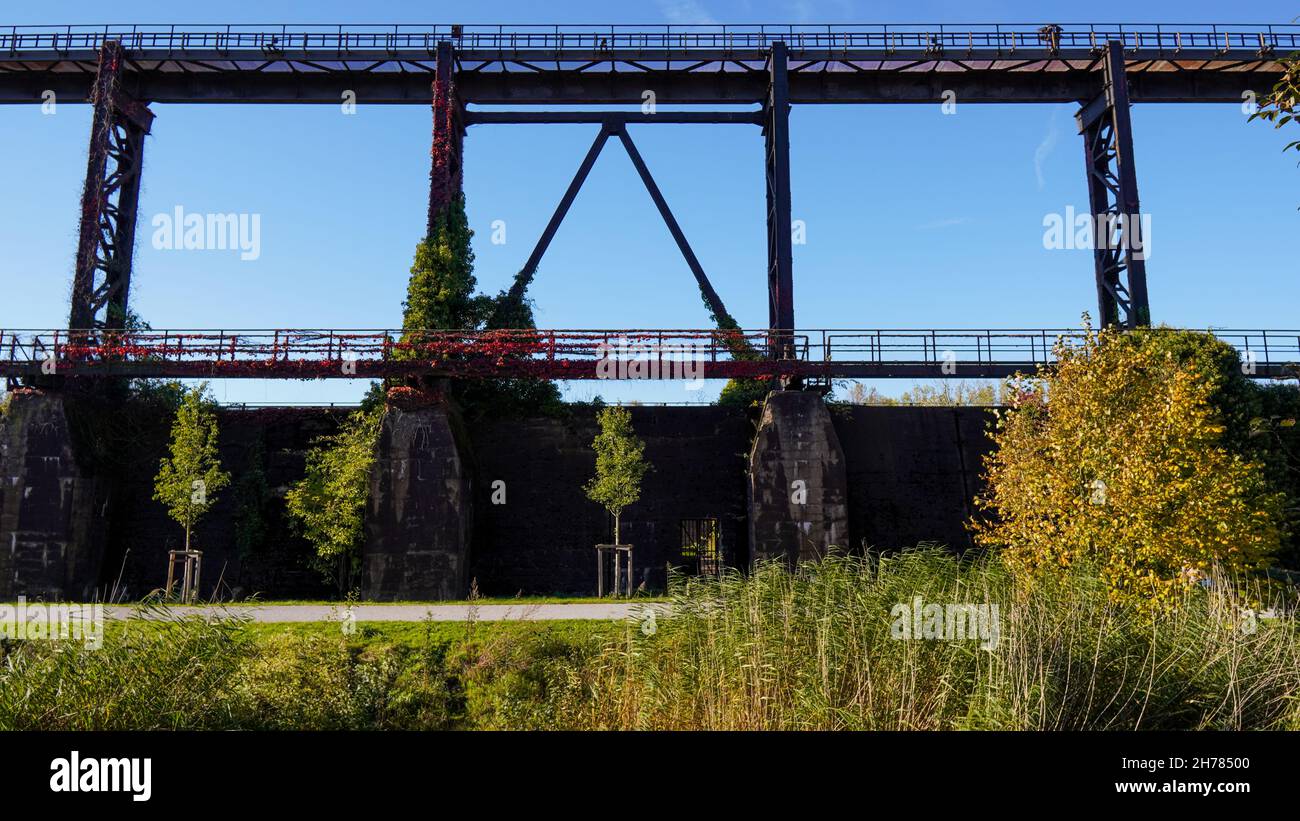 Old rusty industrial bridges in contrast with nature Stock Photo - Alamy
