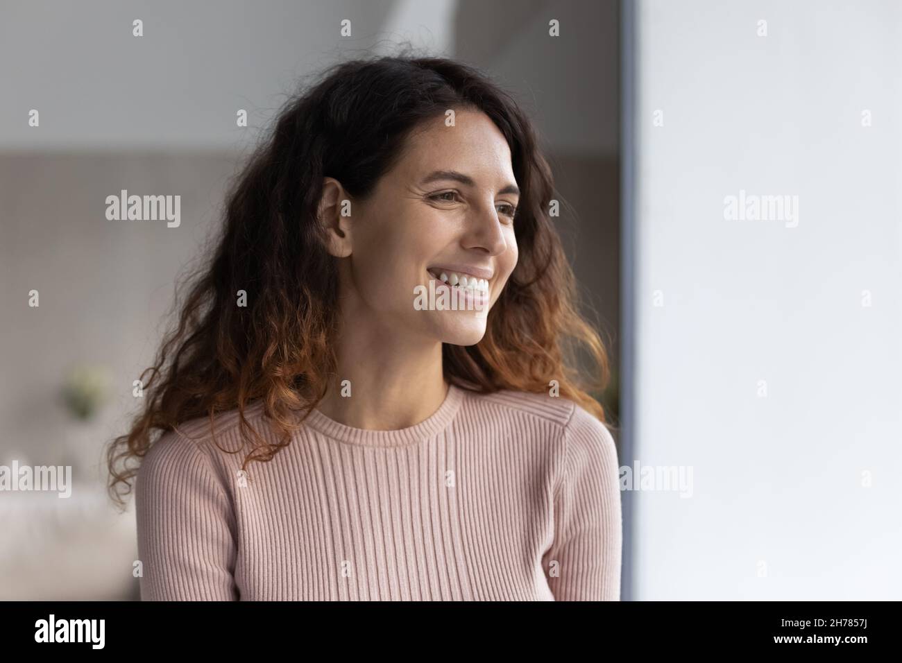 Head shot portrait dreamy smiling woman looking in distance Stock Photo ...