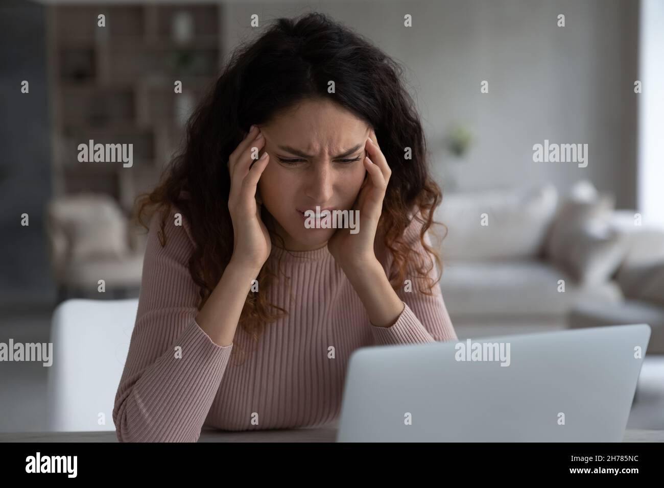 Confused student looking laptop screen hi-res stock photography and ...