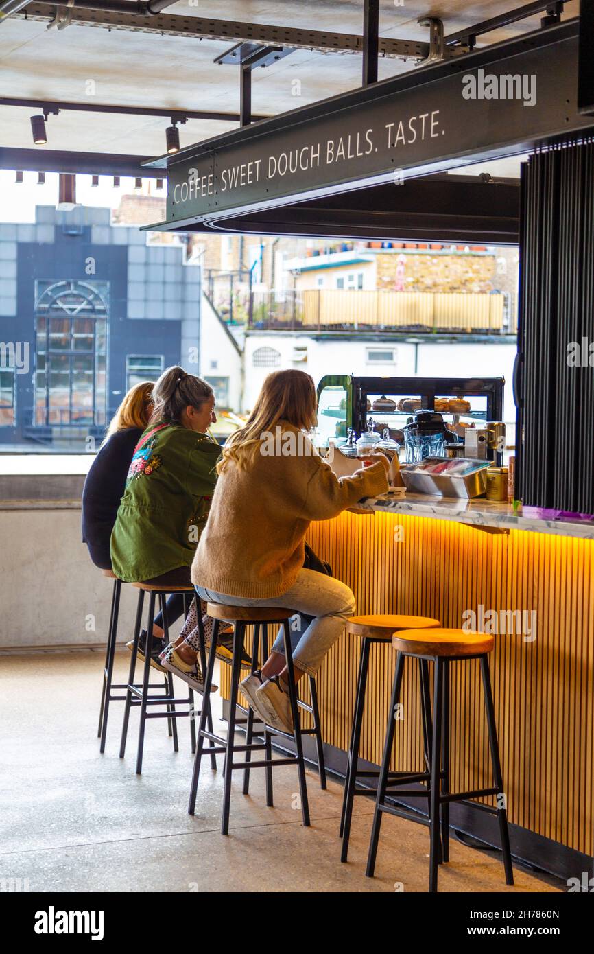 Camden market women sitting hi-res stock photography and images - Alamy