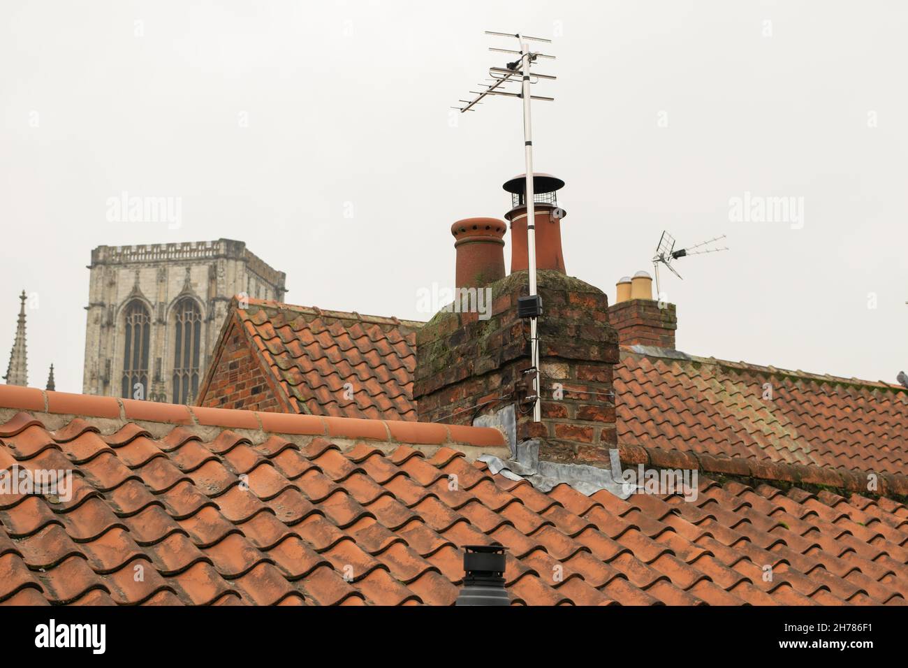 Roof tiles and chimneys of British terraced houses in York England ...