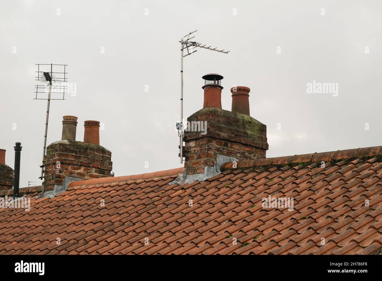Roof tiles and chimneys of British terraced houses in York England ...