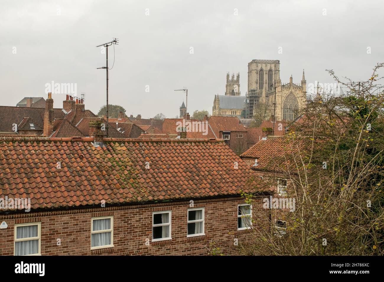 Rooftops of British brick houses with view of York Minster in York ...