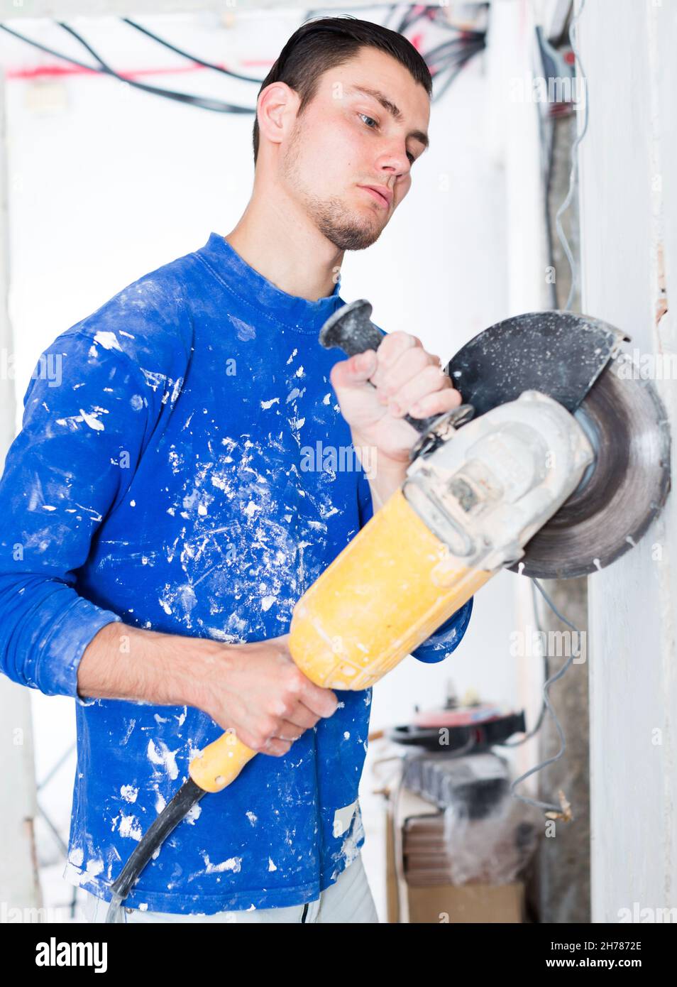 Young worker angle grinder hi-res stock photography and images - Alamy