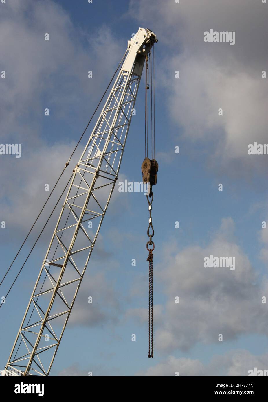 A Tall Jib Crane with Strong Metal Lifting Chains Stock Photo - Alamy