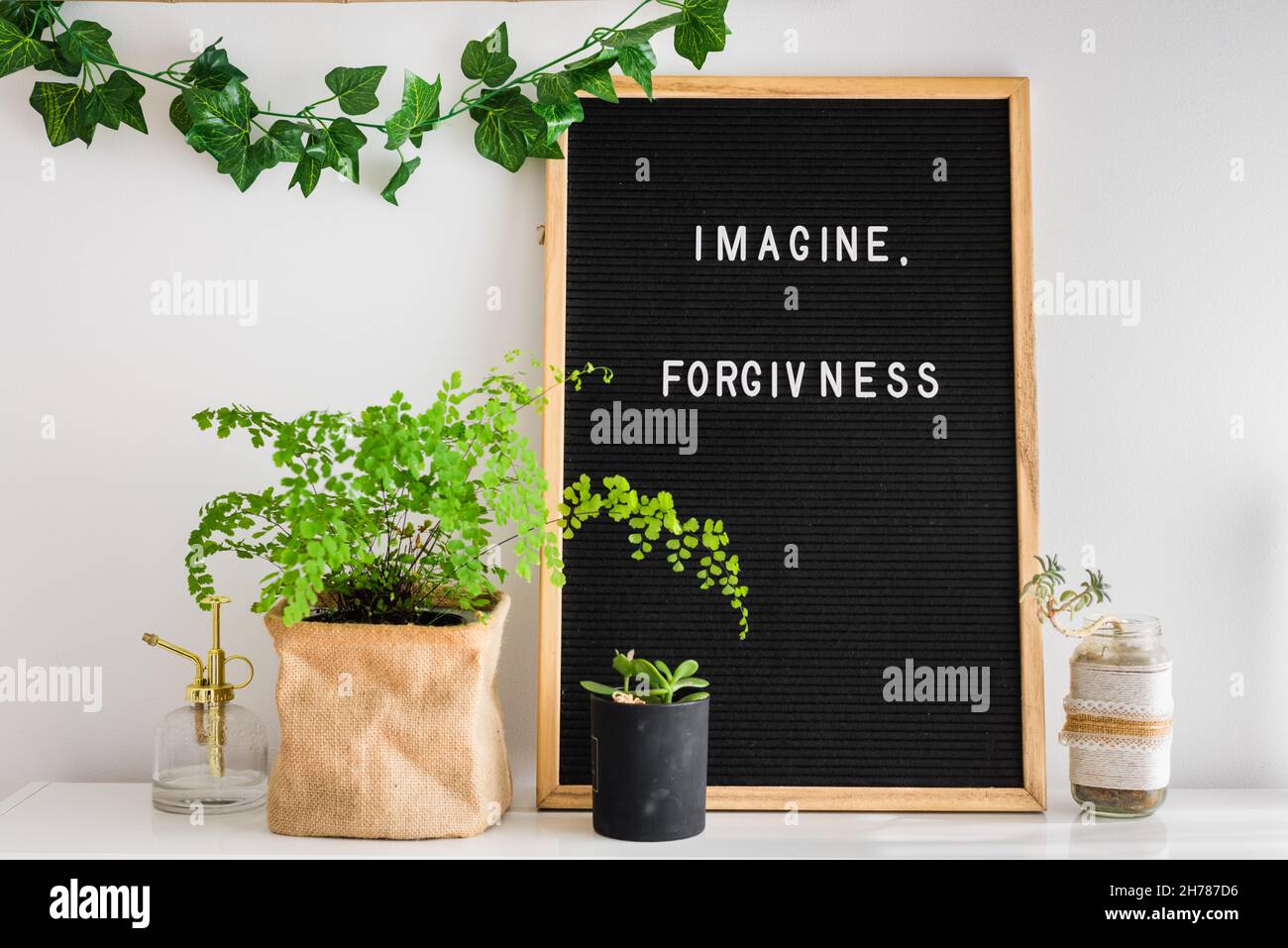 houseplant and sign Stock Photo - Alamy