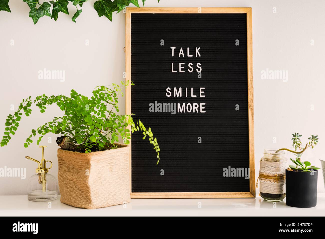houseplant and sign Stock Photo - Alamy