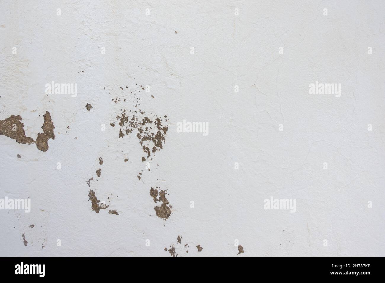 Old cracked weathered shabby white painted plastered peeled wall ...