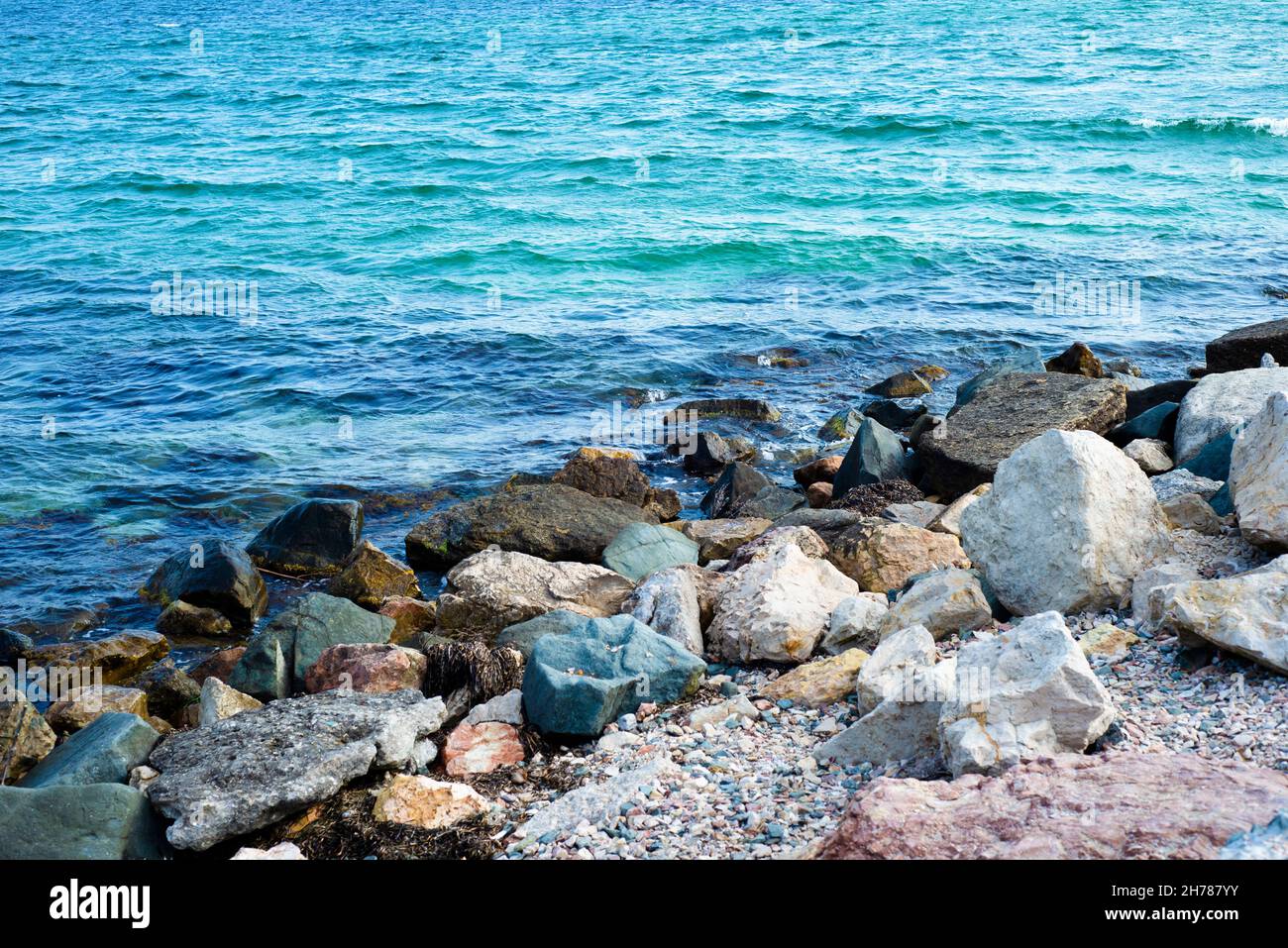 Colored boulders at the edge of the sea. Stones. Marine nature Stock ...