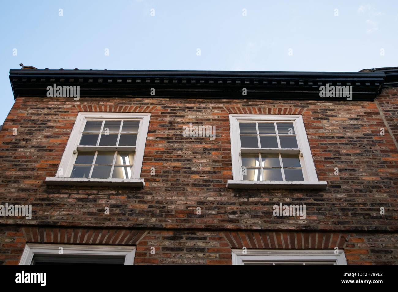 Windows on facade of traditional British brick house in York Stock ...