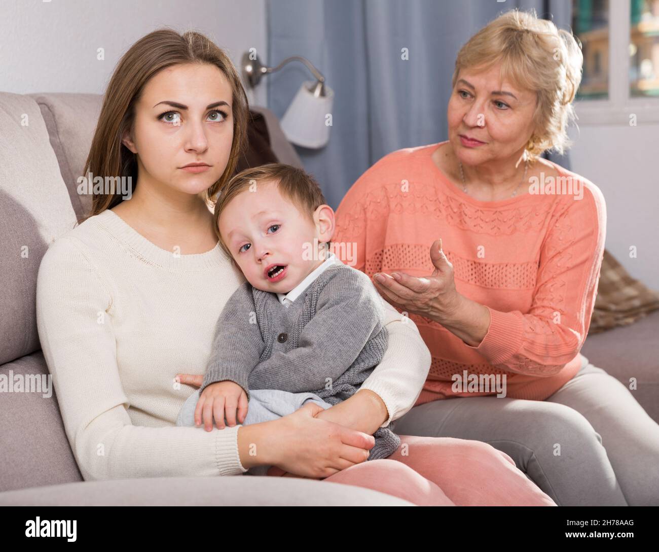 Two women are quarreling for upbringing toddler Stock Photo - Alamy
