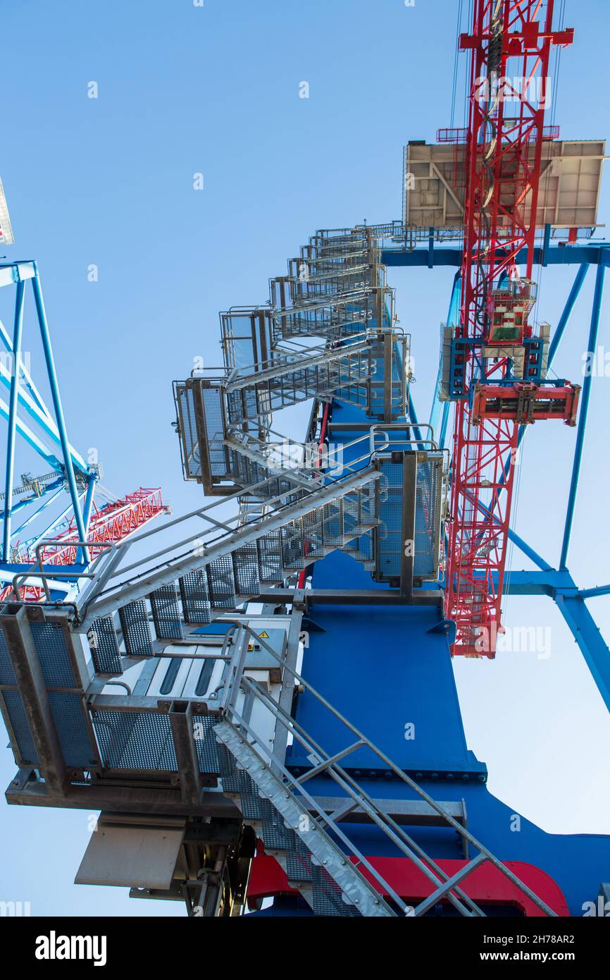 Cranes of container terminal cose up in industrial sea port. industrial ...