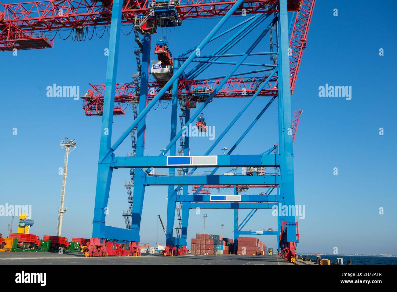 Cranes of container terminal cose up in industrial sea port. industrial ...
