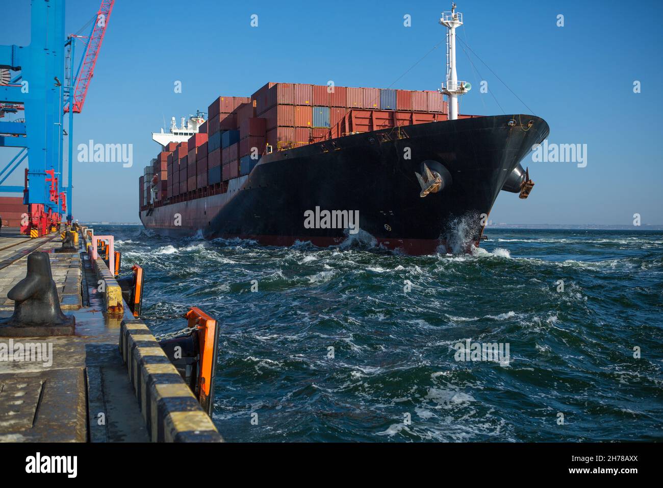 Container ship in port at container terminal. Ships of container ships ...