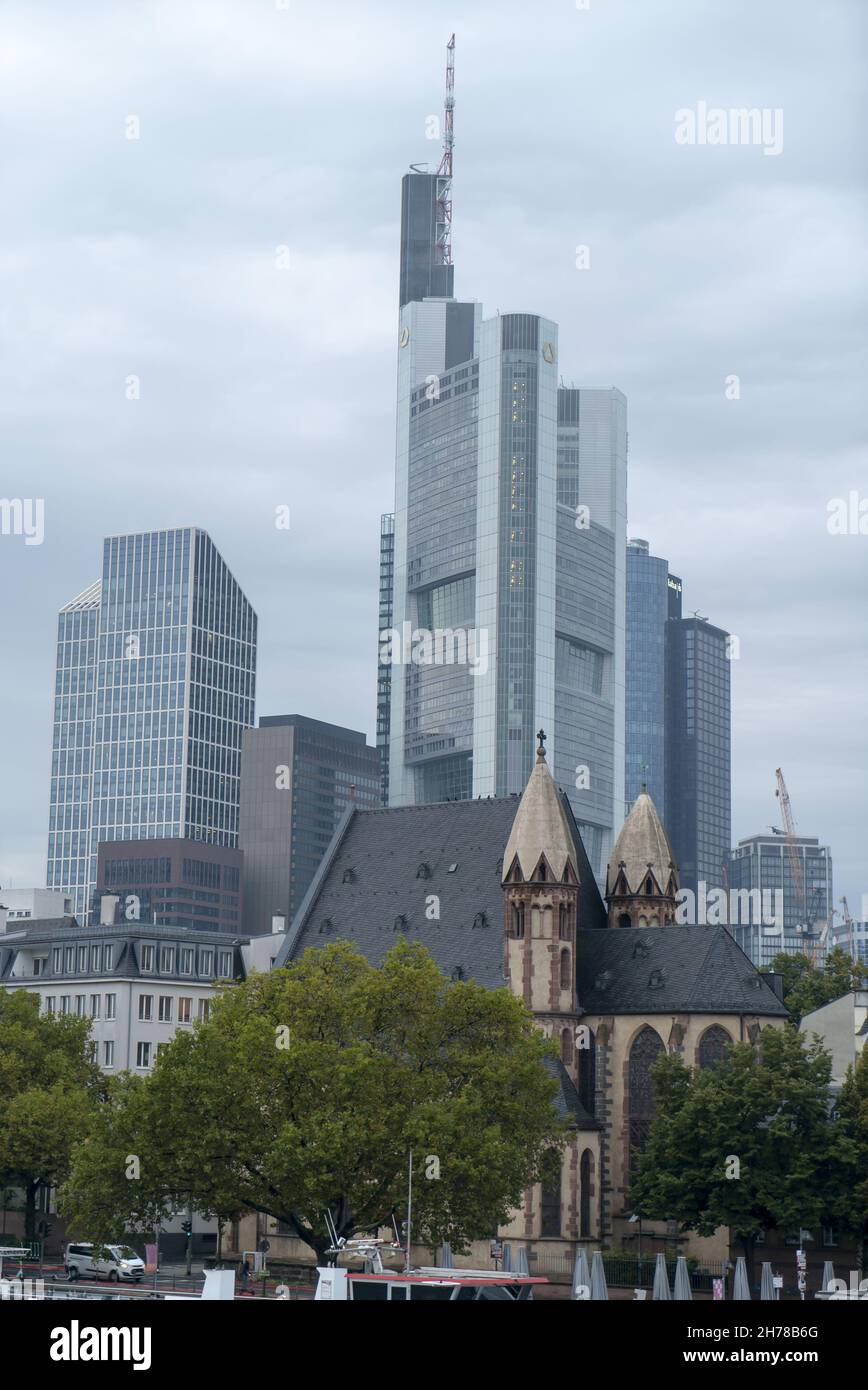 A beautiful modern skyscraper with a light hazy sky in Frankfurt ...