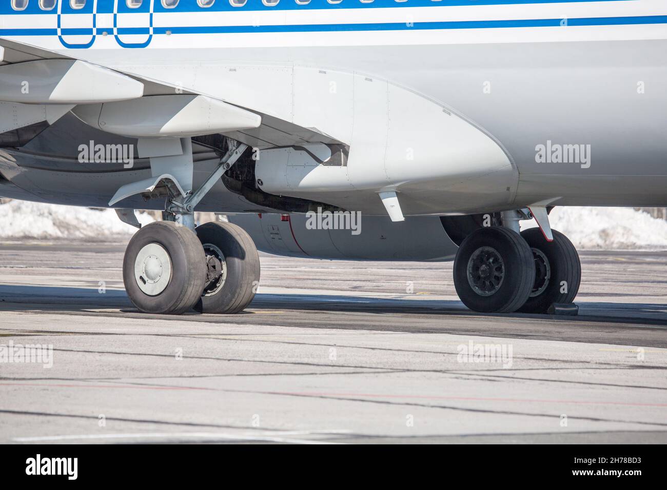 chassis airplane close-up in winter in snow. Close-up of chassis of ...