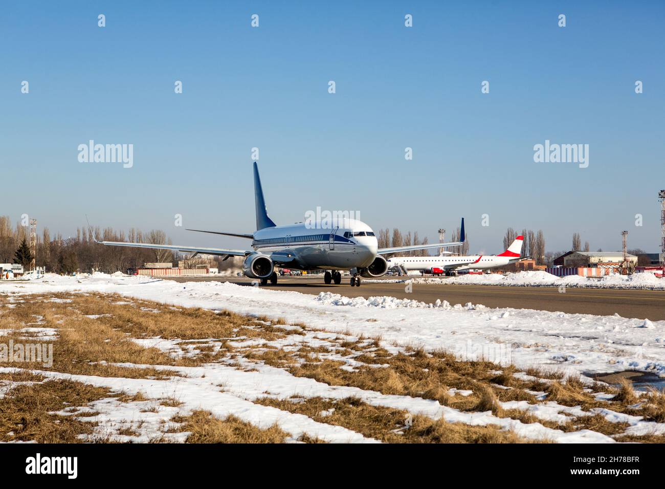 Passenger plane at airport in winter afternoon. plane on airport ...