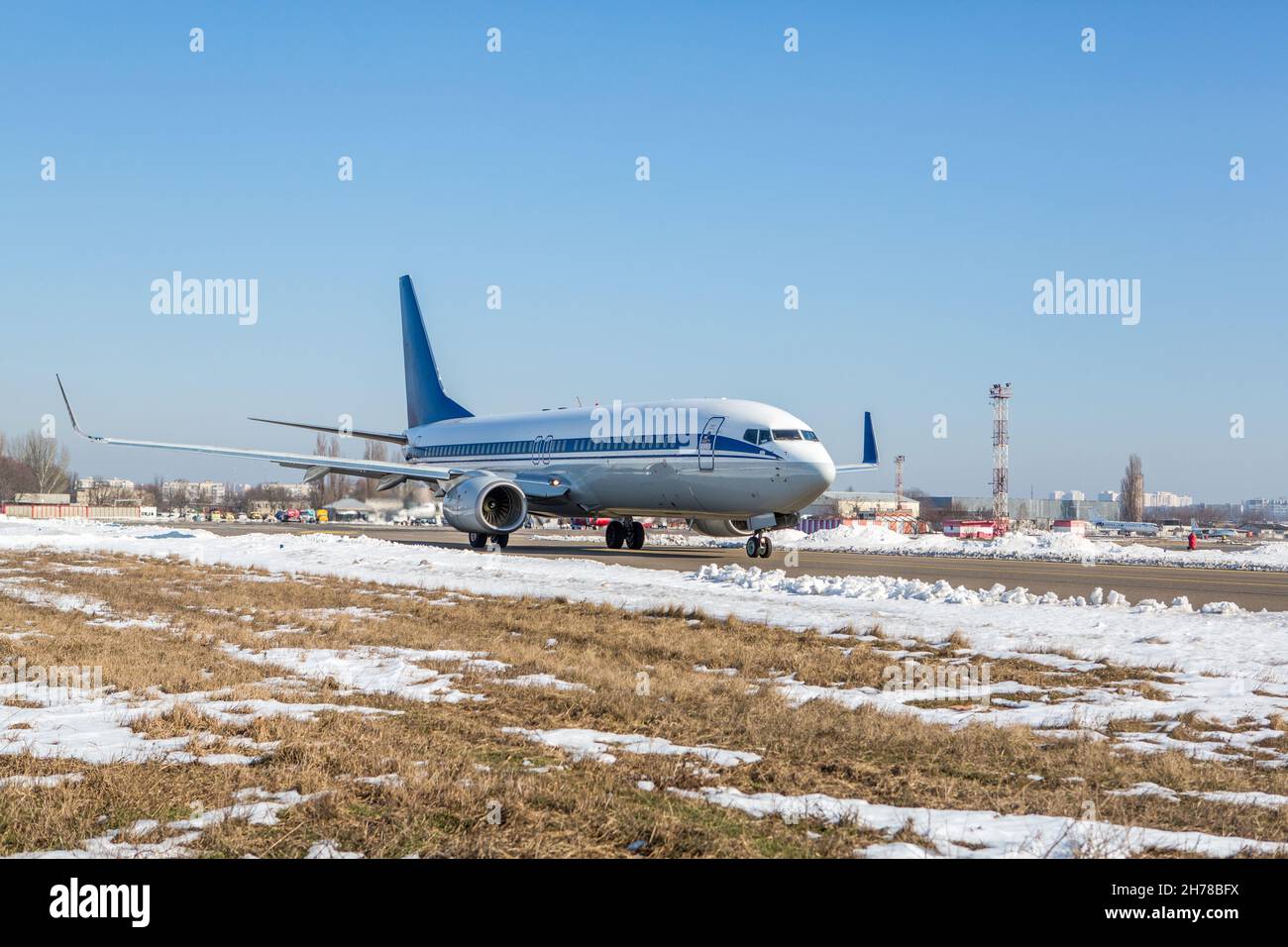 Passenger plane at airport in winter afternoon. plane on airport ...