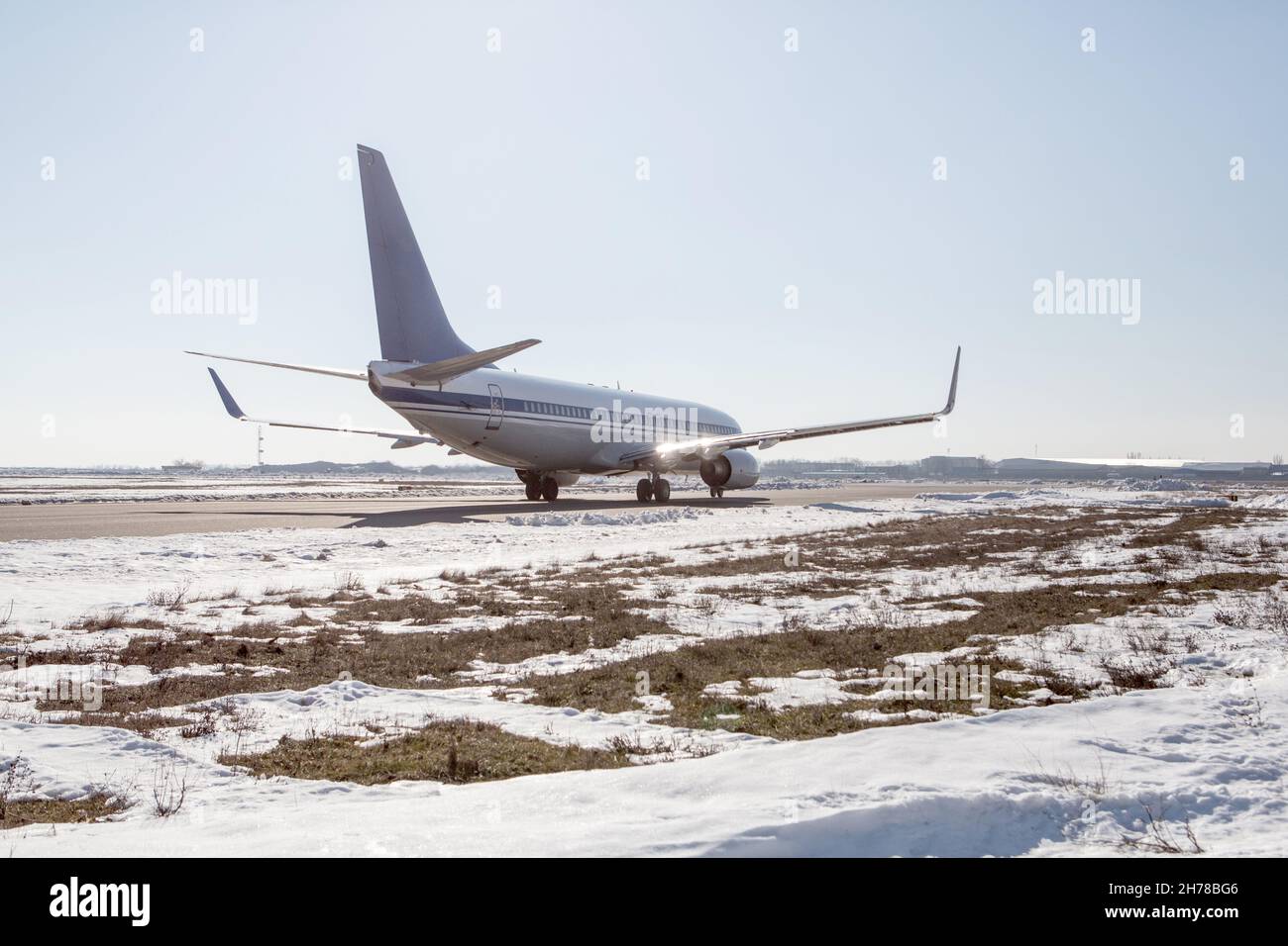 Passenger plane at airport in winter afternoon. plane on airport ...