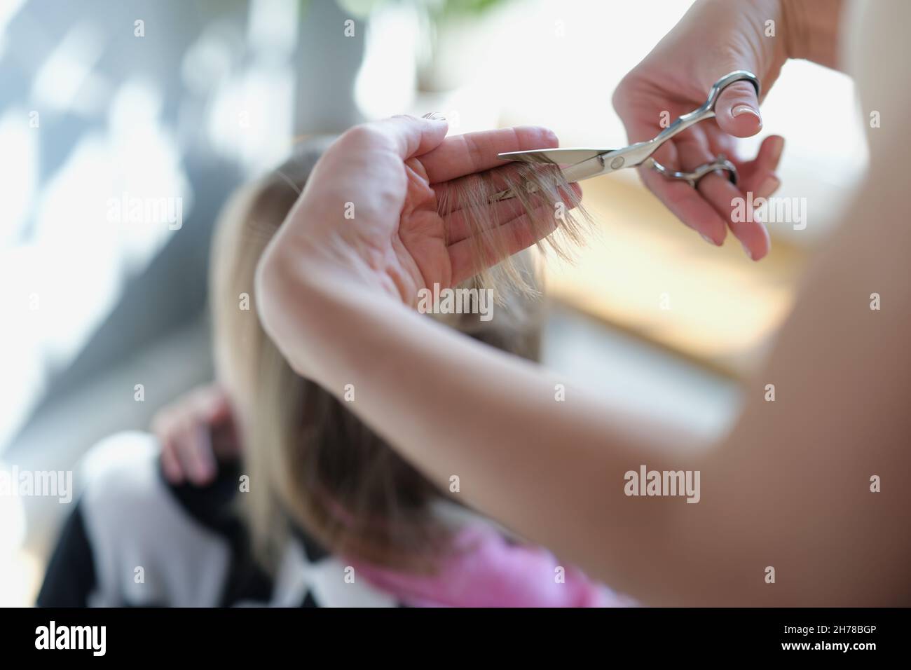 Hairdresser barber cuts client close hi-res stock photography and ...